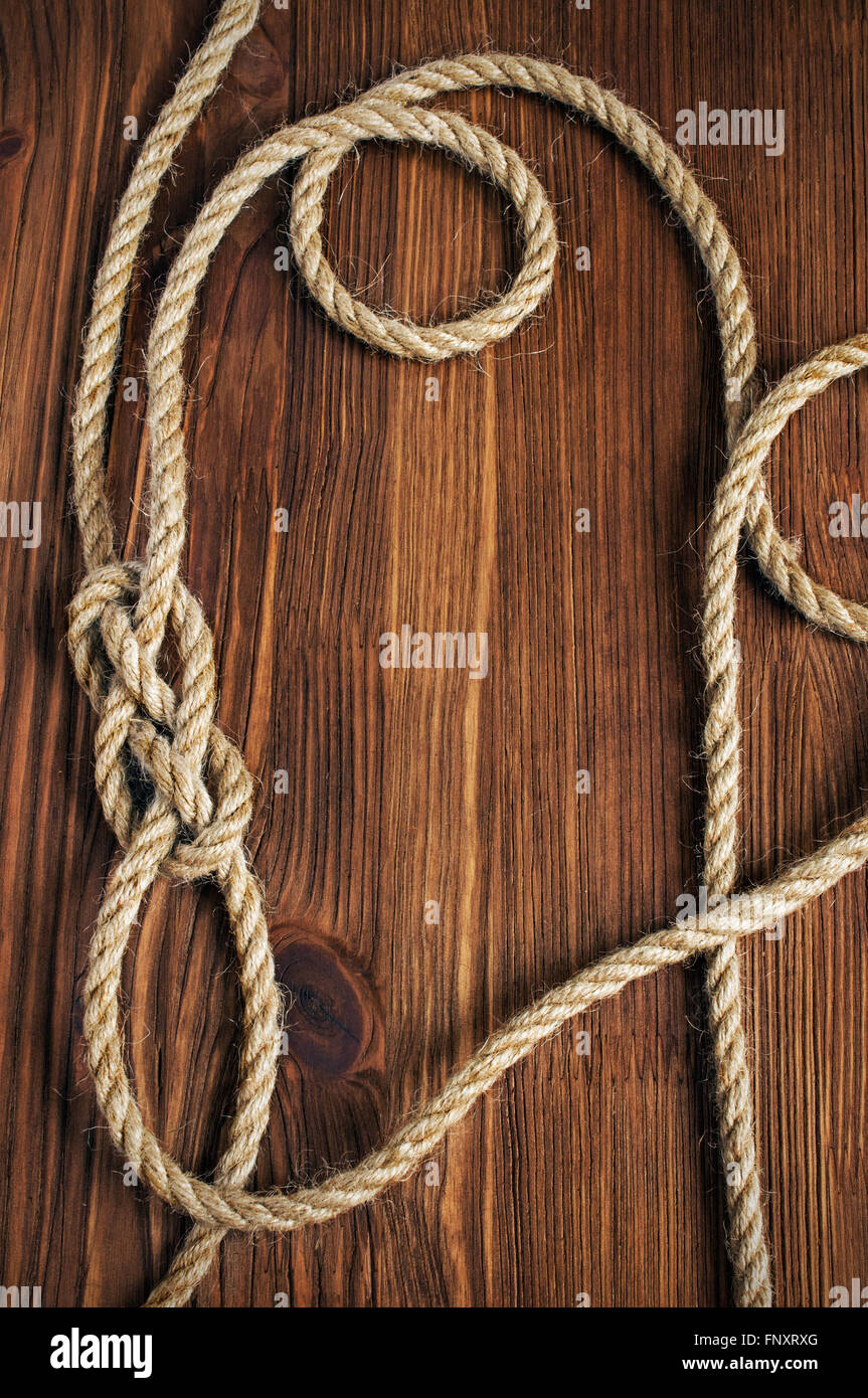 Nautical background with rope and sailor's knot Stock Photo - Alamy
