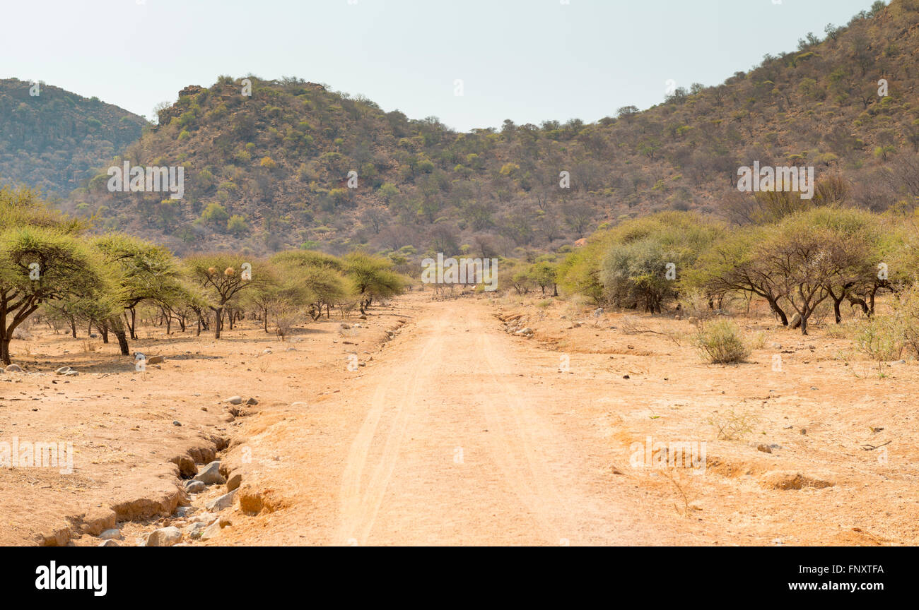 Dirt road in Botswana, Africa in a remote rural area with mountains ...
