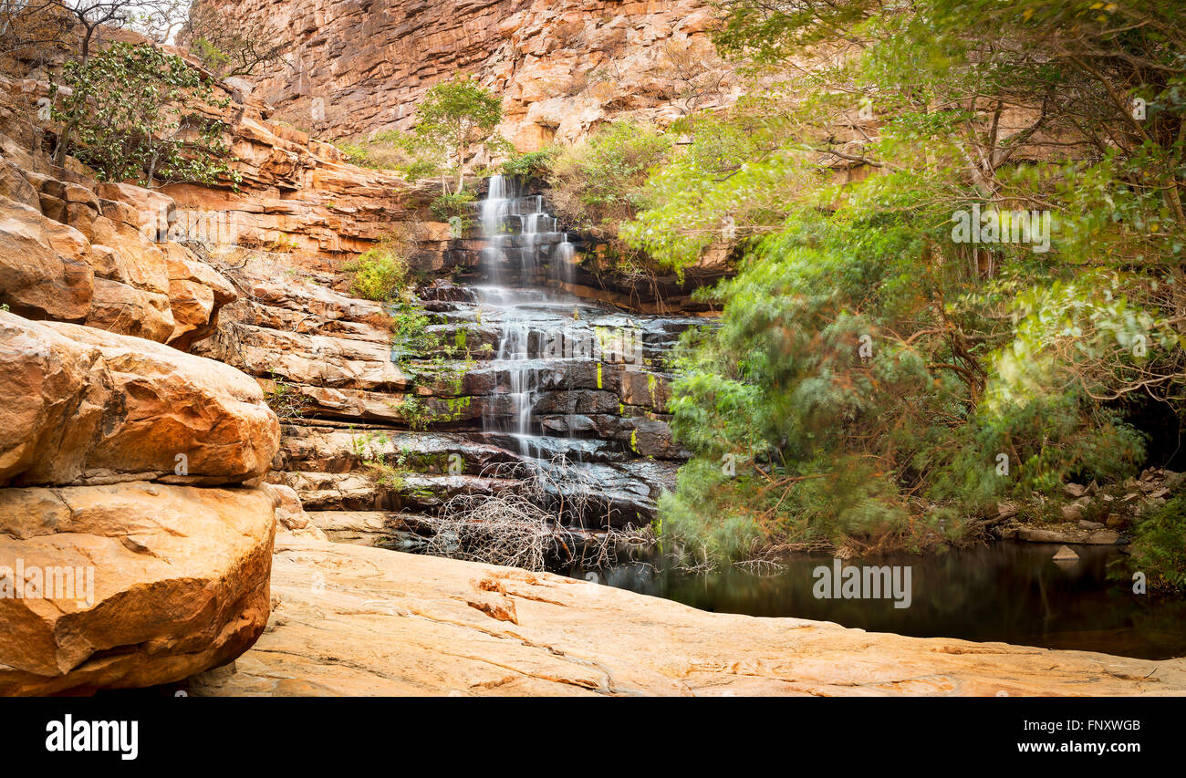 Waterfall in Moremi Gorge, Botswana, Africa flowing down into the gorge ...