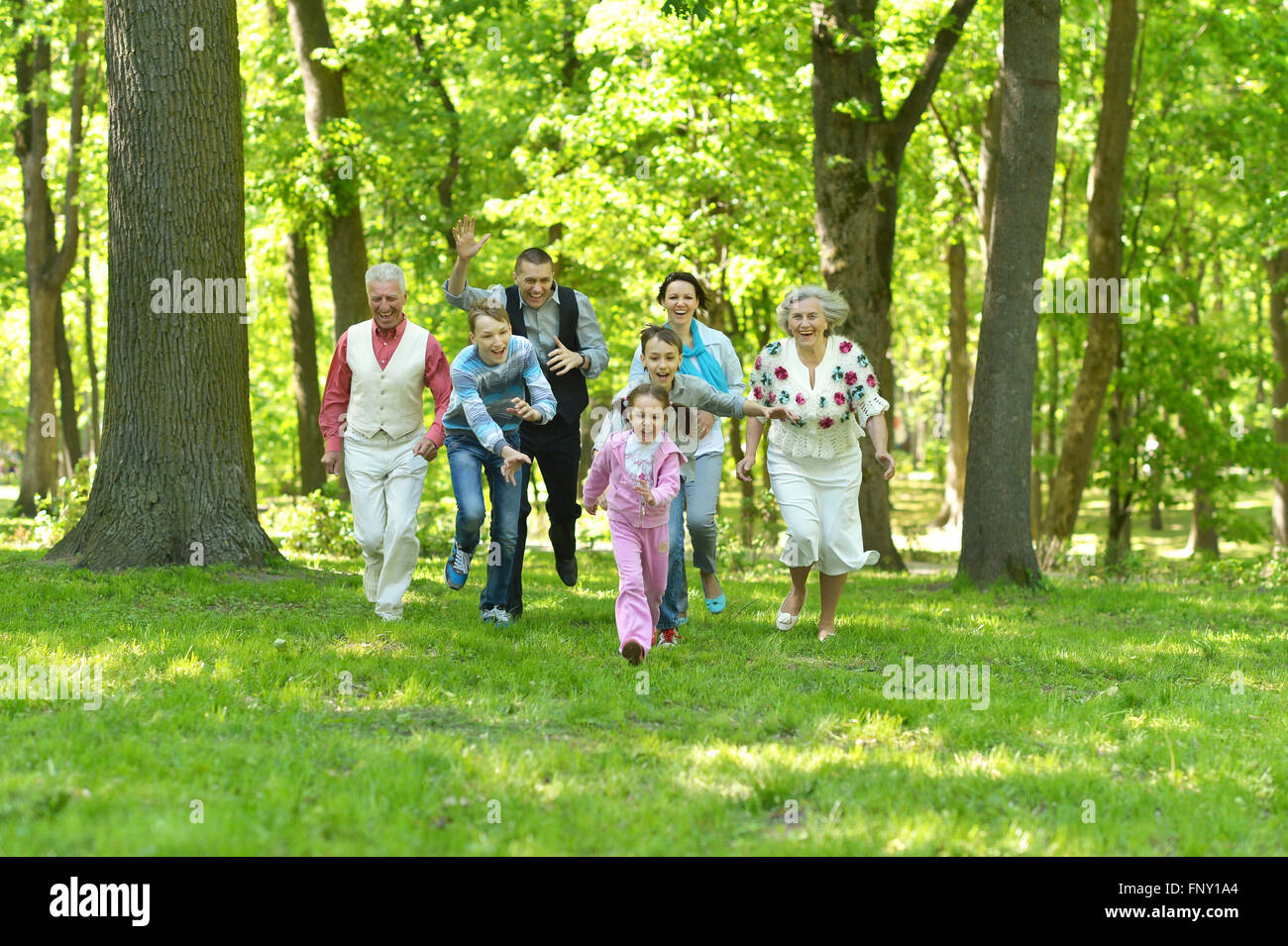 smiling family run Stock Photo - Alamy