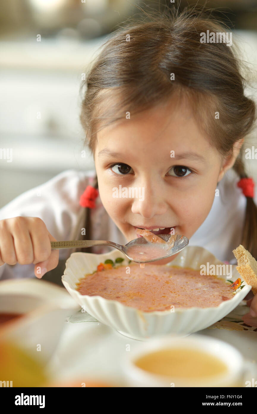 girl eating soup Stock Photo - Alamy