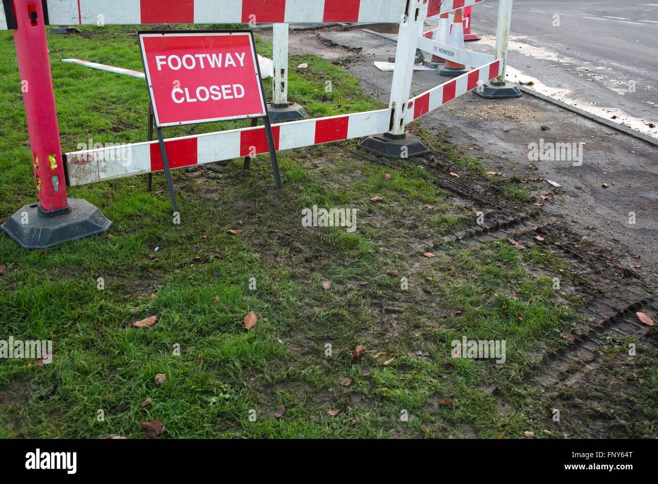 Warning barrier and sign on a pathway Stock Photo - Alamy