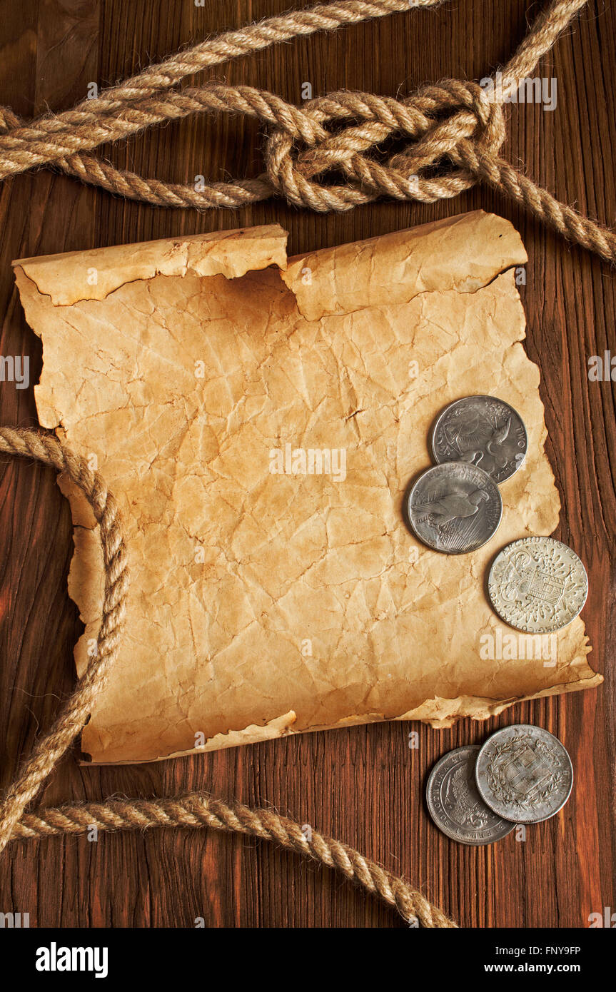 Nautical background with old map and rope on a wooden Stock Photo - Alamy