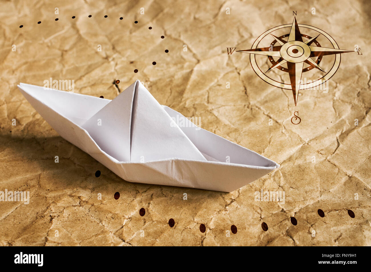 Paper boat on the old map closeup. Travel concept Stock Photo - Alamy