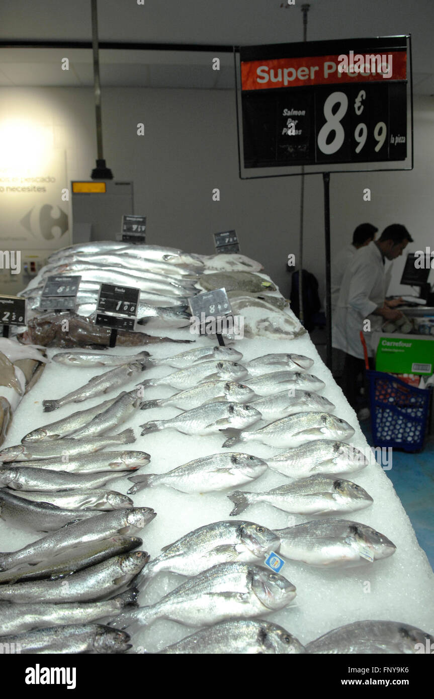 Fish section at a Carrefour Supermarket in Malaga Spain Stock Photo - Alamy