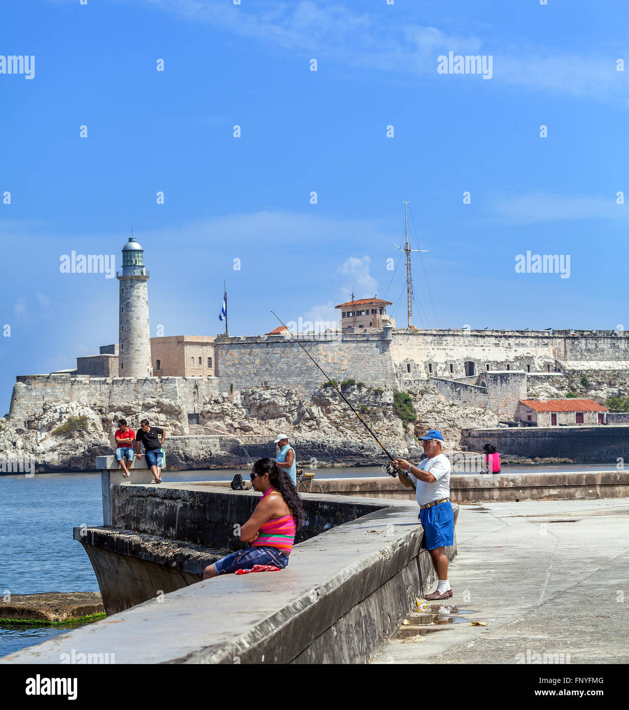 HAVANA, CUBA - APRIL 1, 2012: Native fishermen in front of Moro castle ...