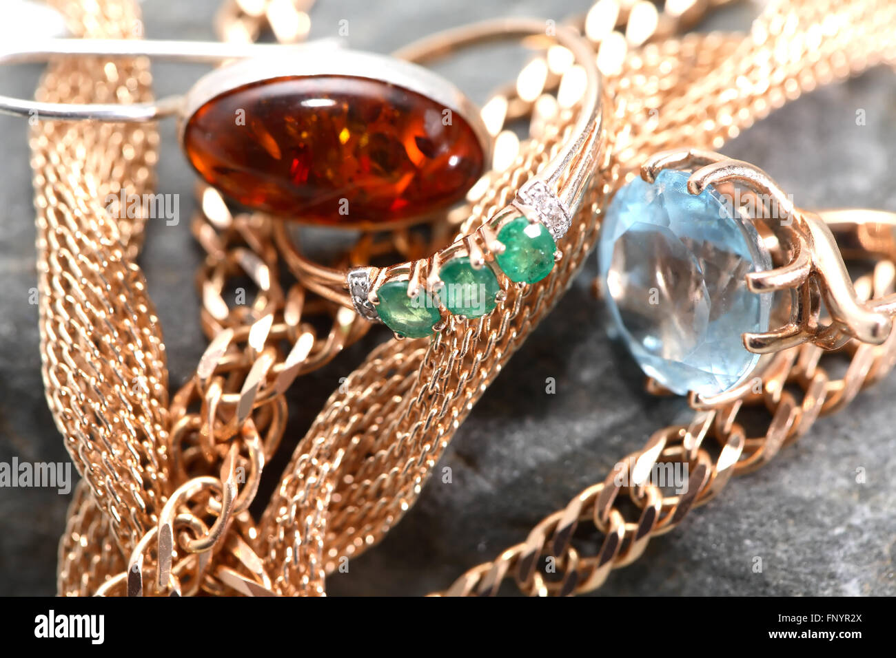 Set of various jewelry adornments on gray stone background Stock Photo ...