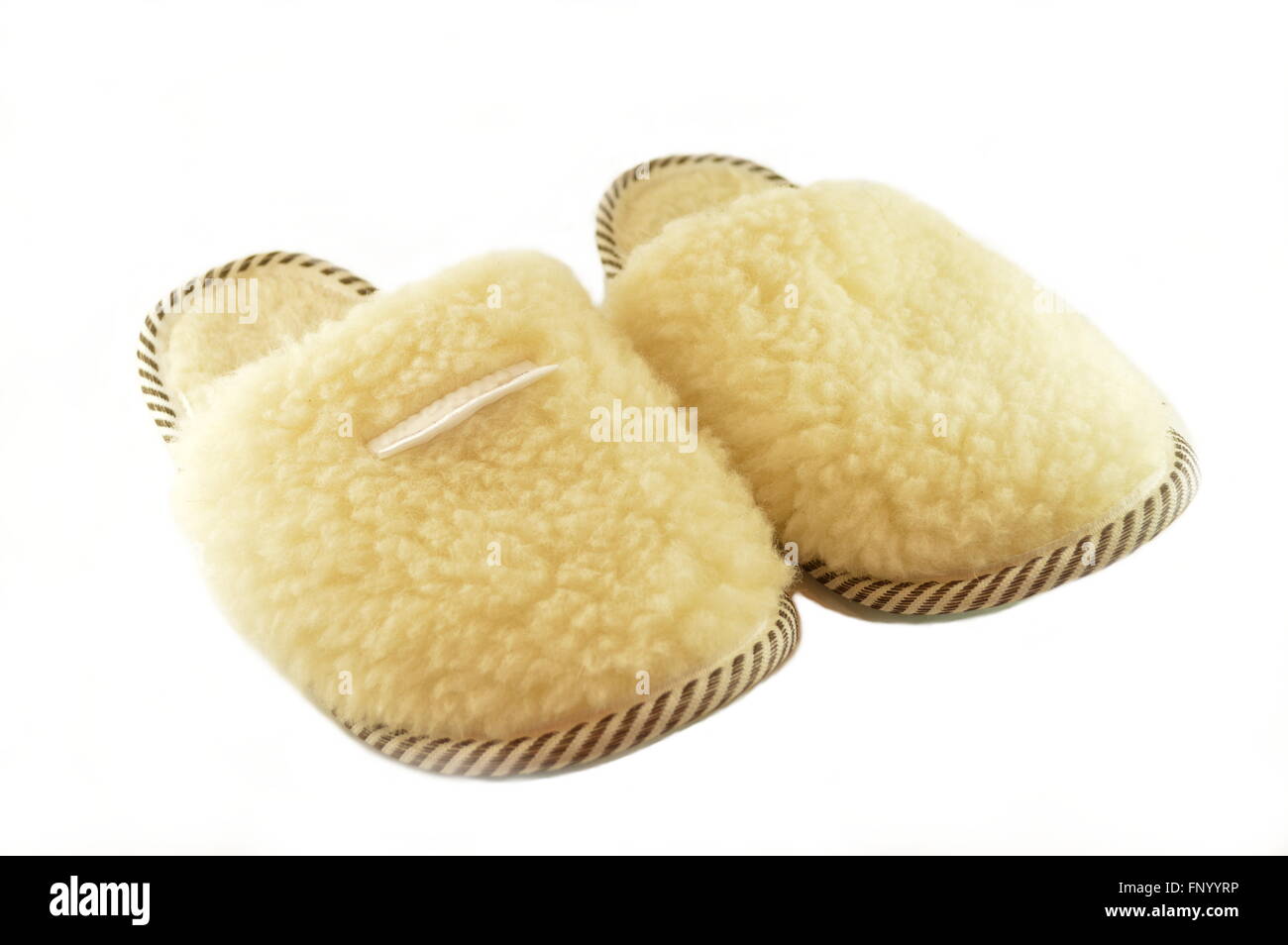 White fur slippers isolated on a white background Stock Photo - Alamy