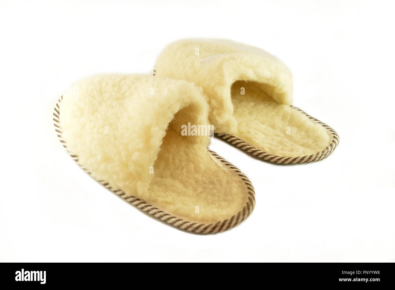 White fur slippers isolated on a white background Stock Photo - Alamy