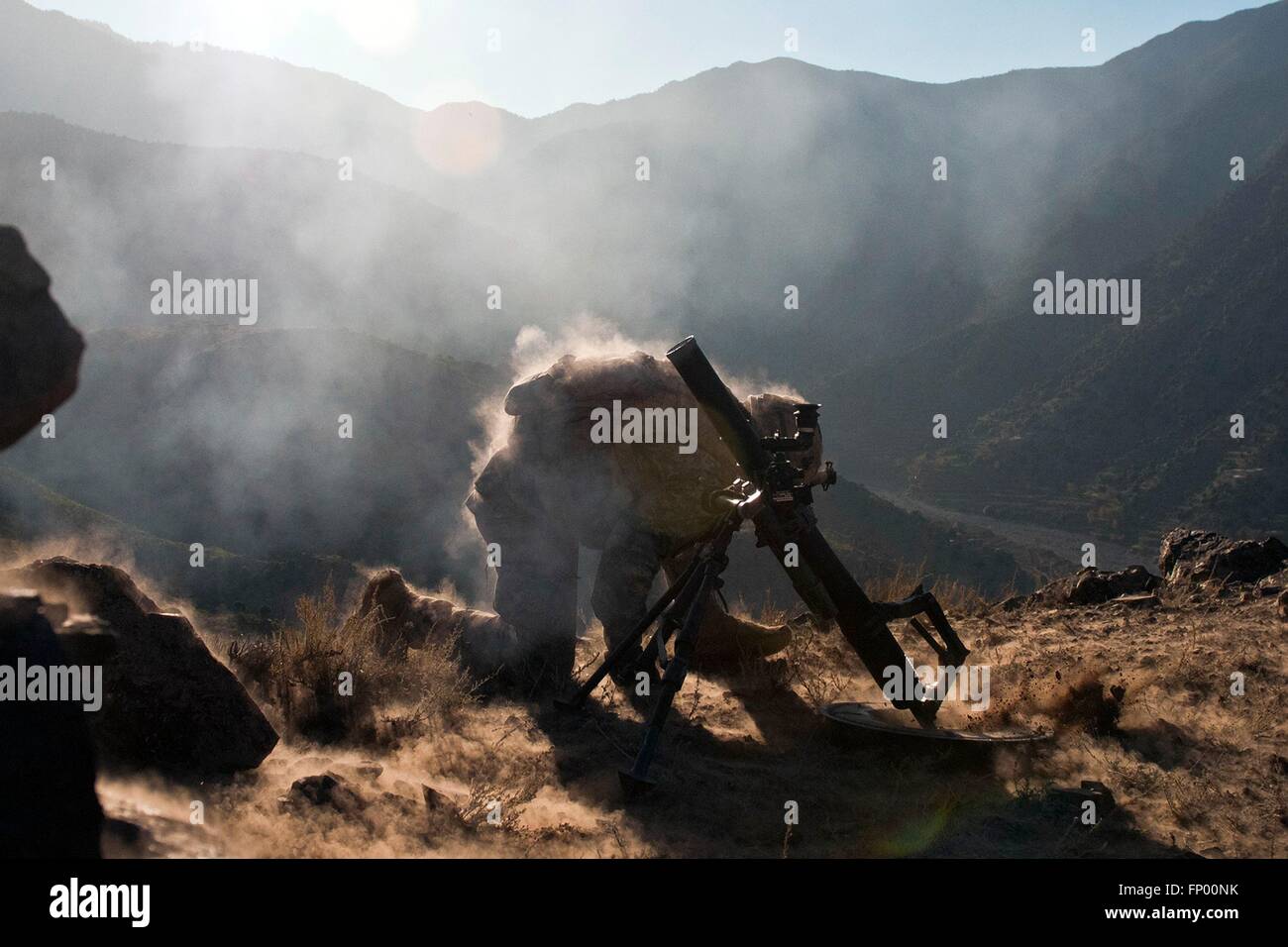U.S. Army soldiers fire a mortar round during operations against the ...