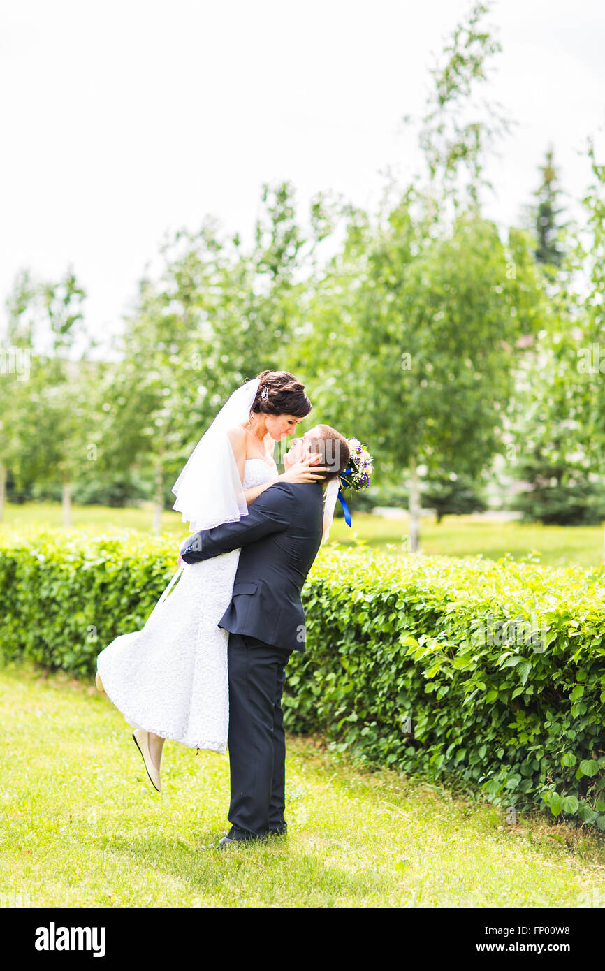 Lovely young newlyweds bride groom hi-res stock photography and images ...