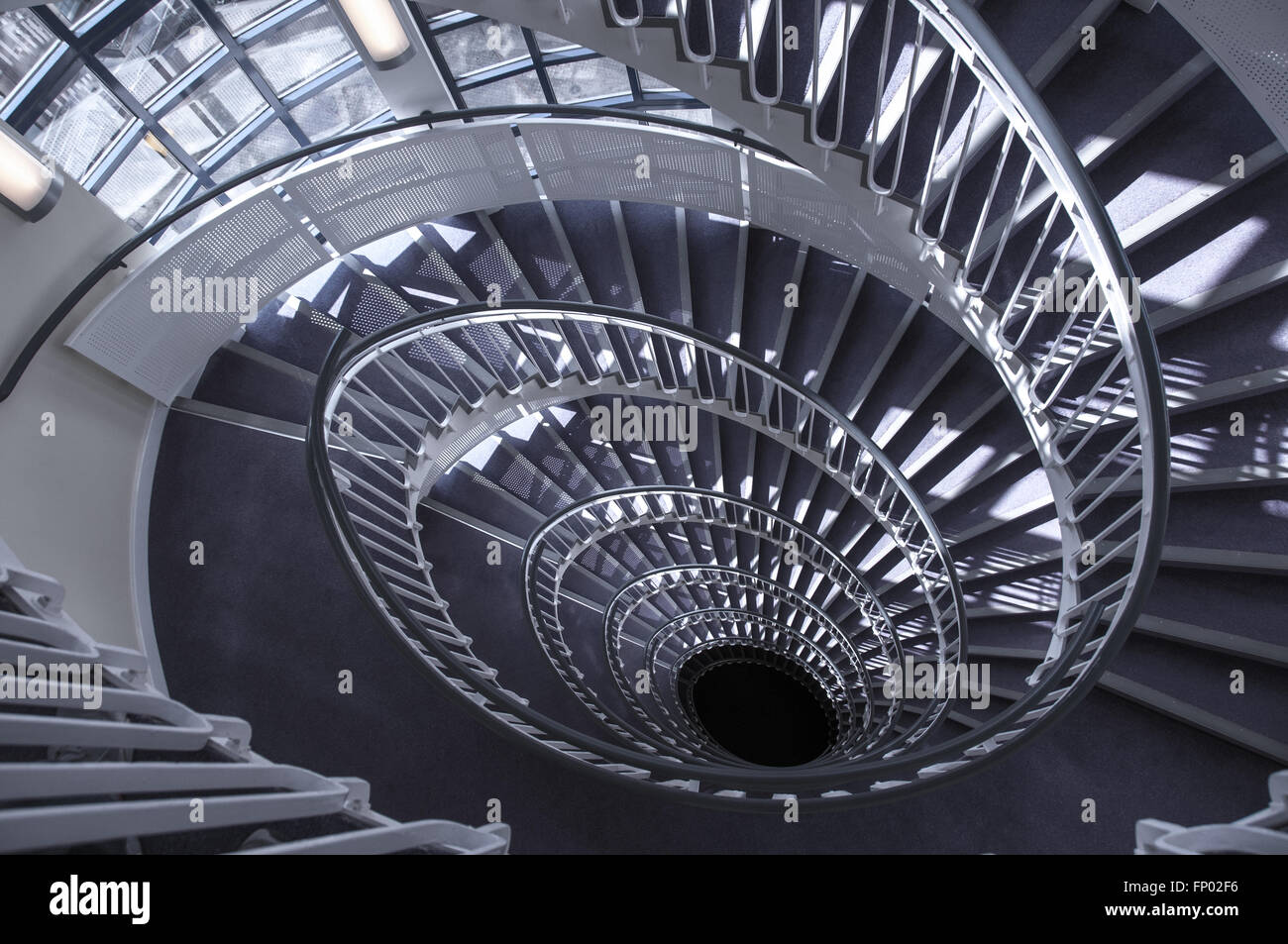 Spiral staircase white with metal handrails at hotel in London, UK ...