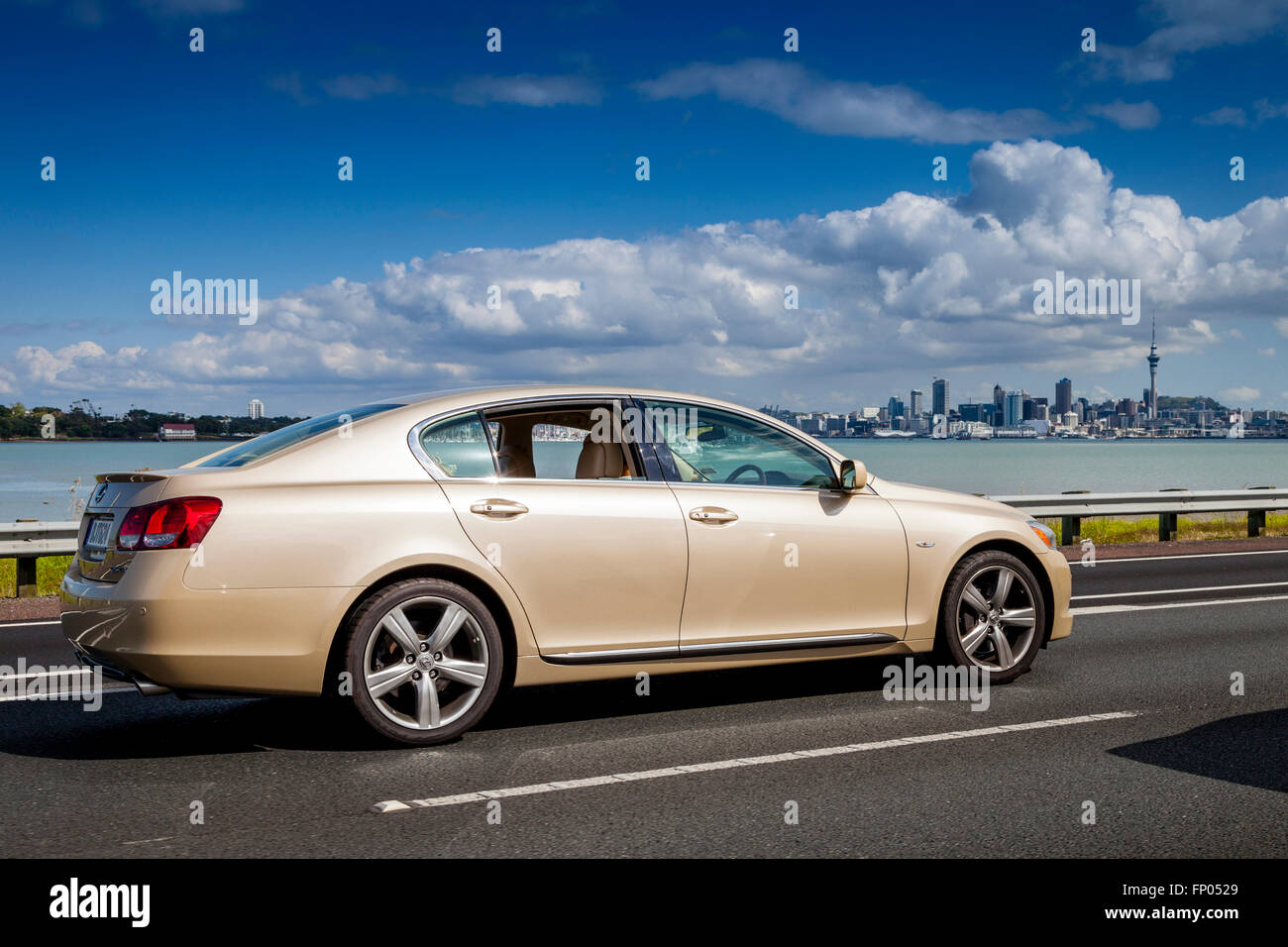 A Car Travelling Over The Auckland Harbour Bridge, Auckland, New ...