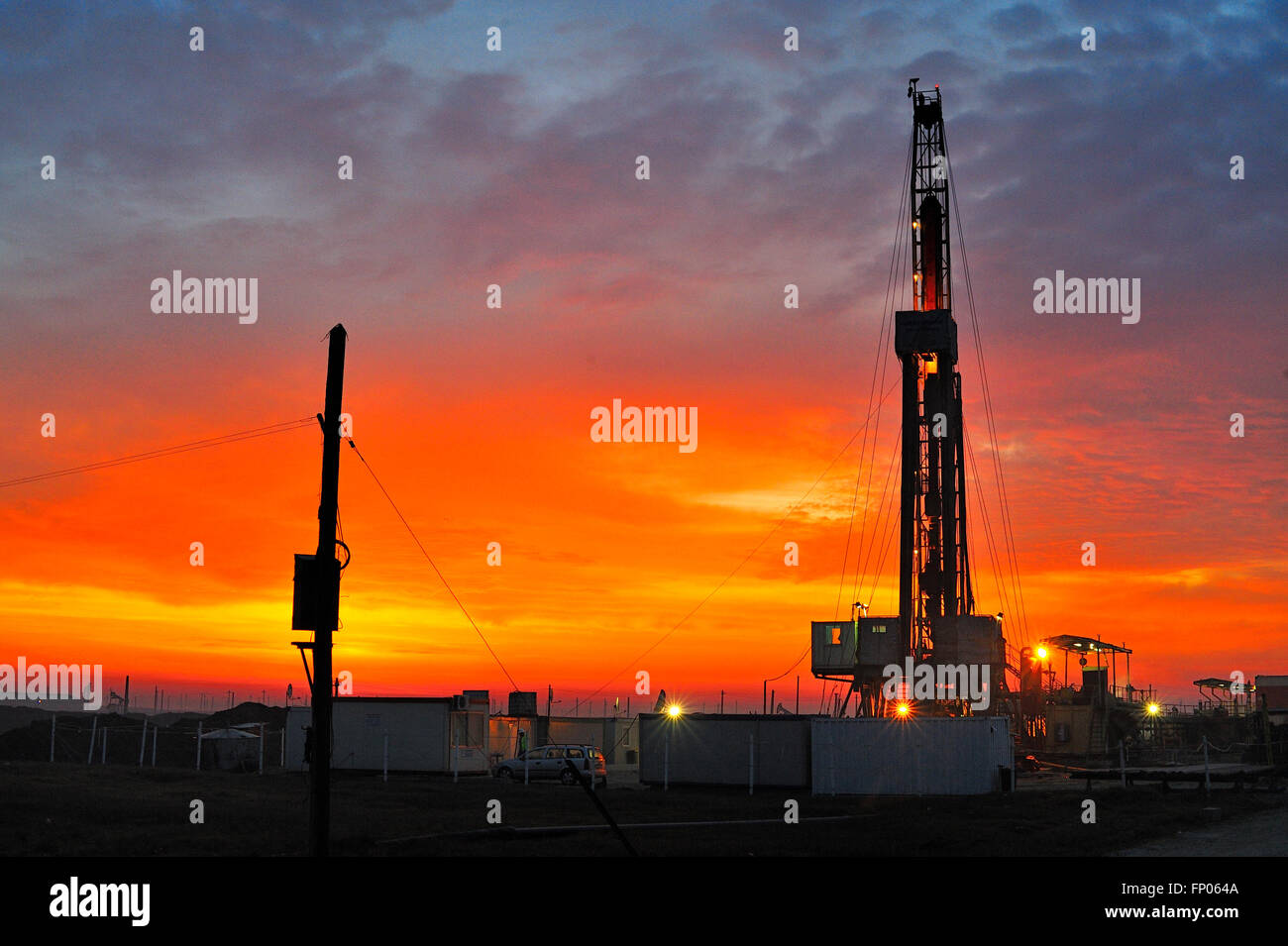Oil well at night Stock Photo - Alamy