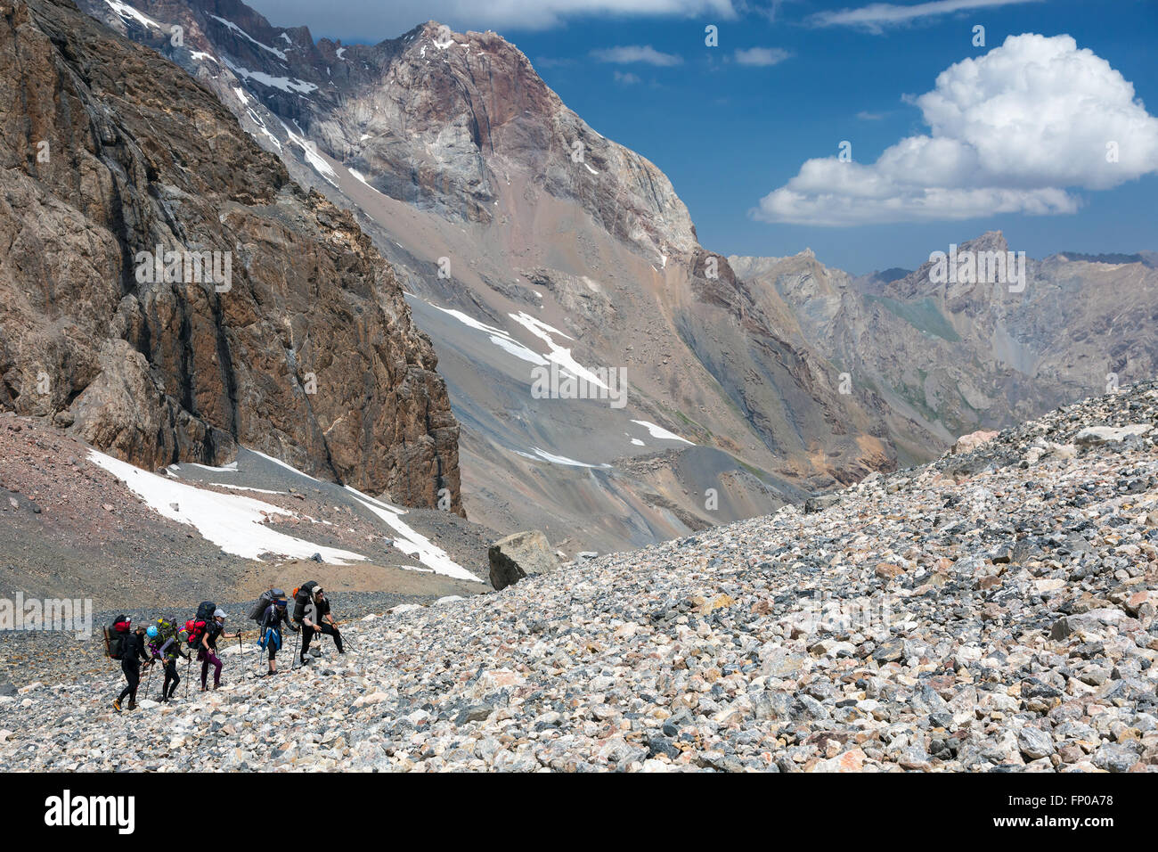 Group people approach high altitude mountain climbing camp heavy ...