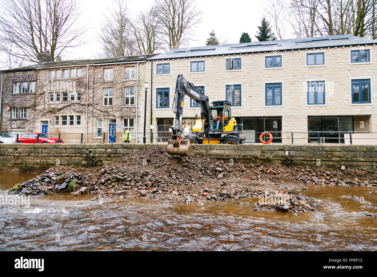 Hebden Bridge, Yorkshire, UK. 15th Mar, 2016. A large excavator gathers ...