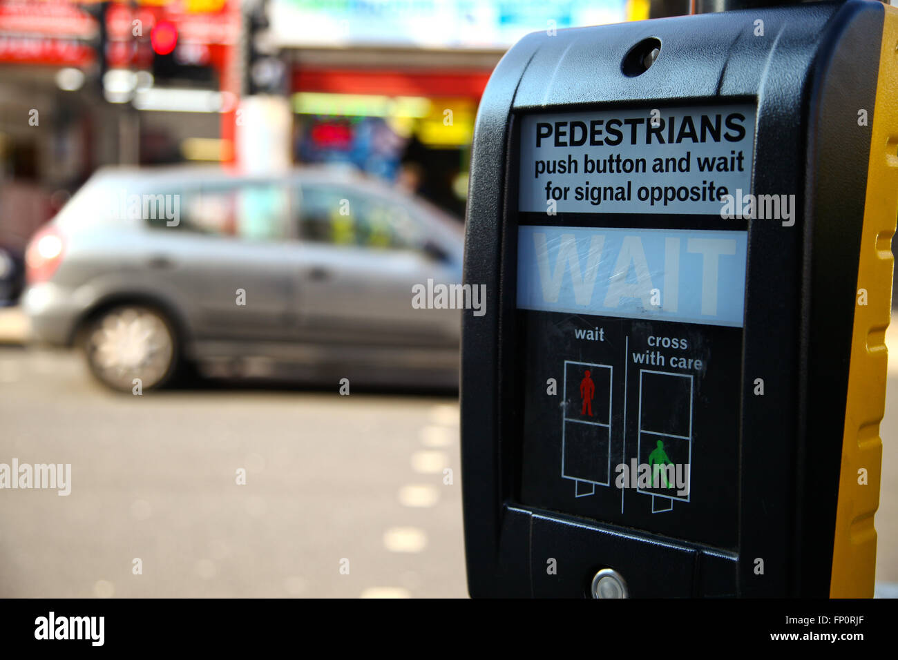 Pedestrian crossing button in North London Stock Photo - Alamy