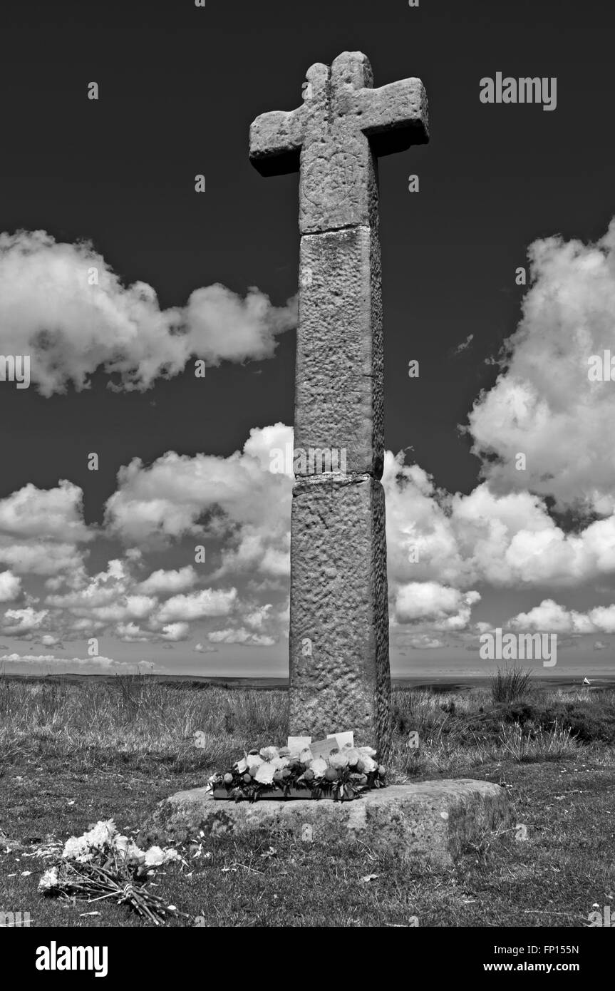 Floral tributes left at the base of Young Ralph Cross, by the ...