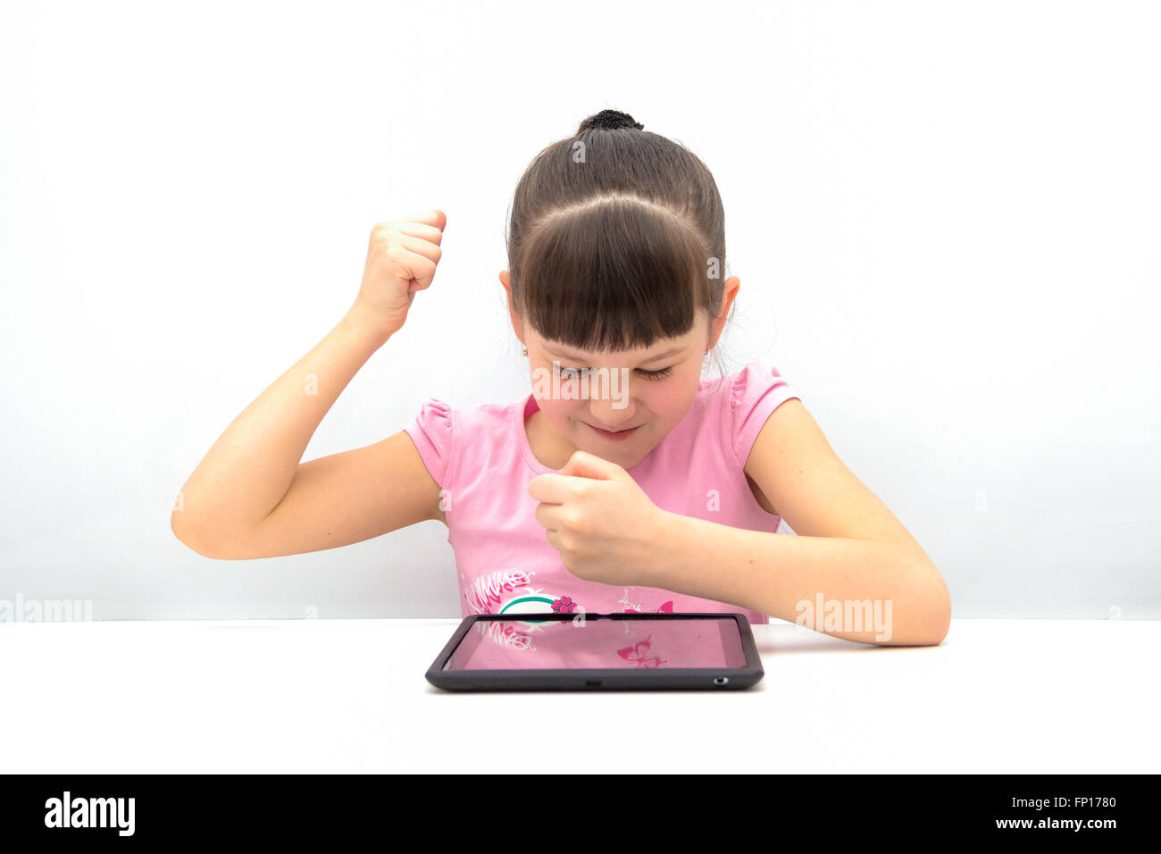 Little girl using a tablet pc Stock Photo - Alamy