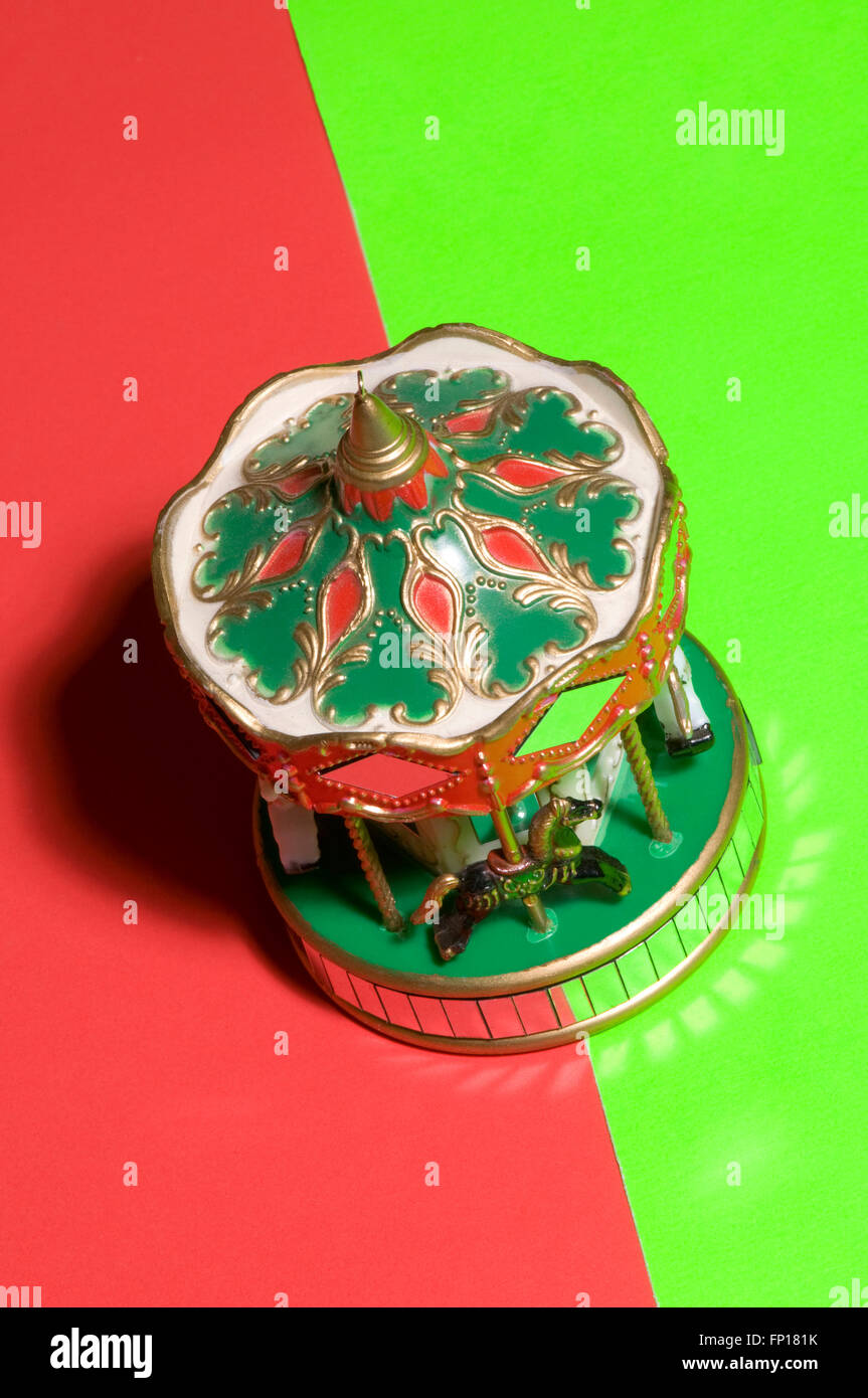 Merry Go Round Ornament on green red Stock Photo - Alamy