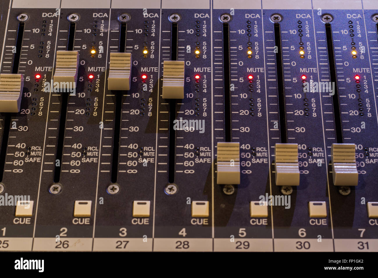 A closeup of the faders on an audio board Stock Photo - Alamy