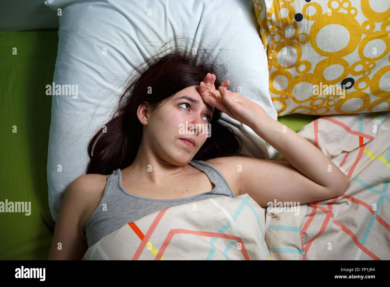 Tired woman sleeping on a bed at home Stock Photo - Alamy