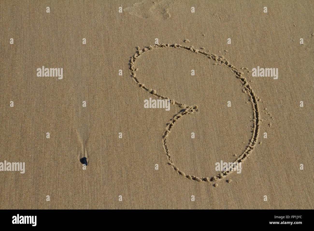Sideways heart drawn in the sand Stock Photo - Alamy