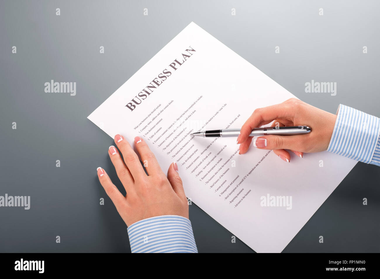 Woman's hand with business plan. Female employee's business plan. Brief ...