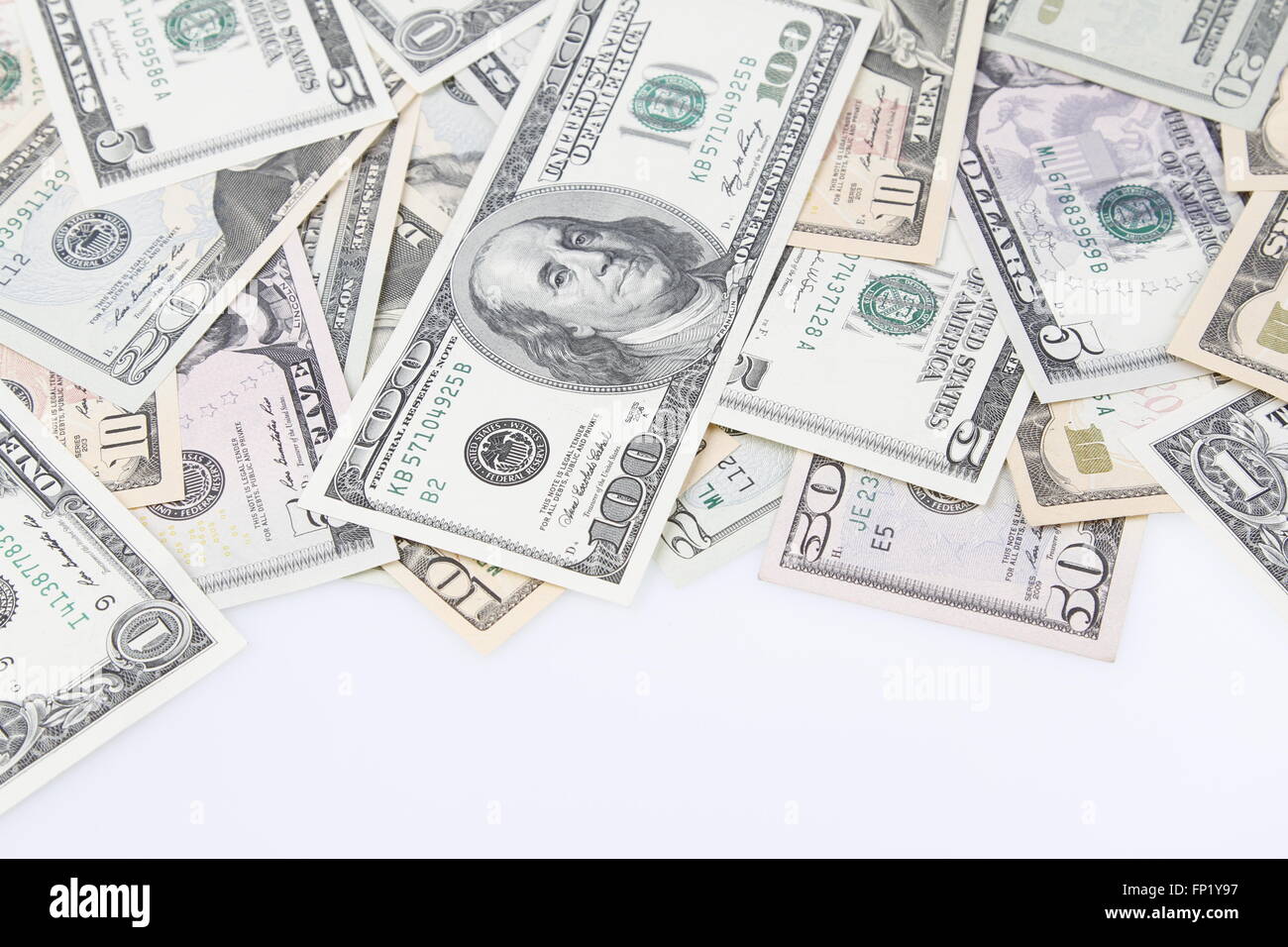 Closeup of assorted American banknotes on plain background Stock Photo ...