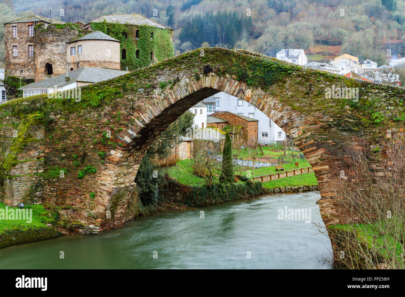 Medieval bridge and castle of Navia de Suarna (Ancares). Ancares is a ...