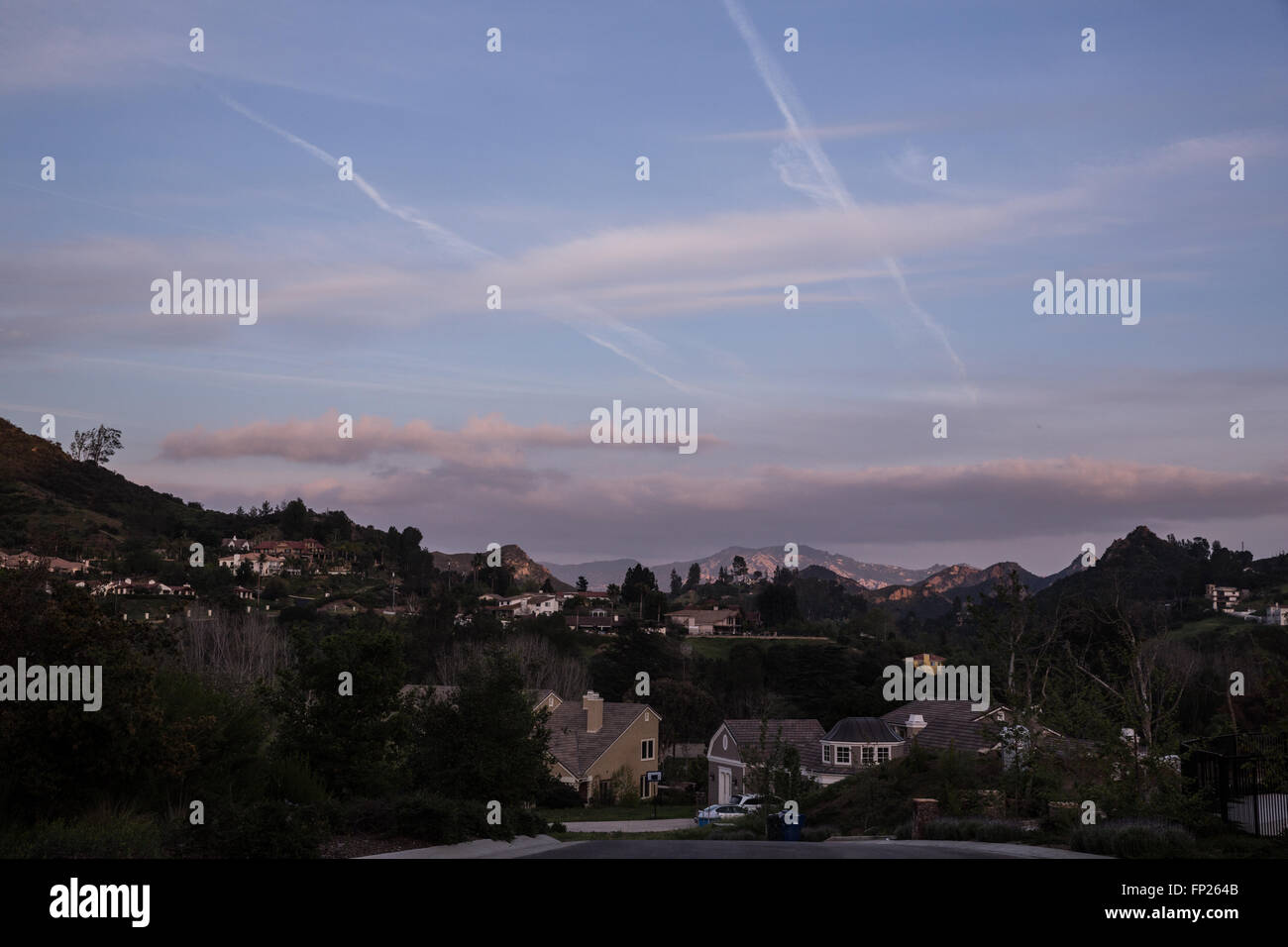 Sunset over a neighborhood Stock Photo - Alamy