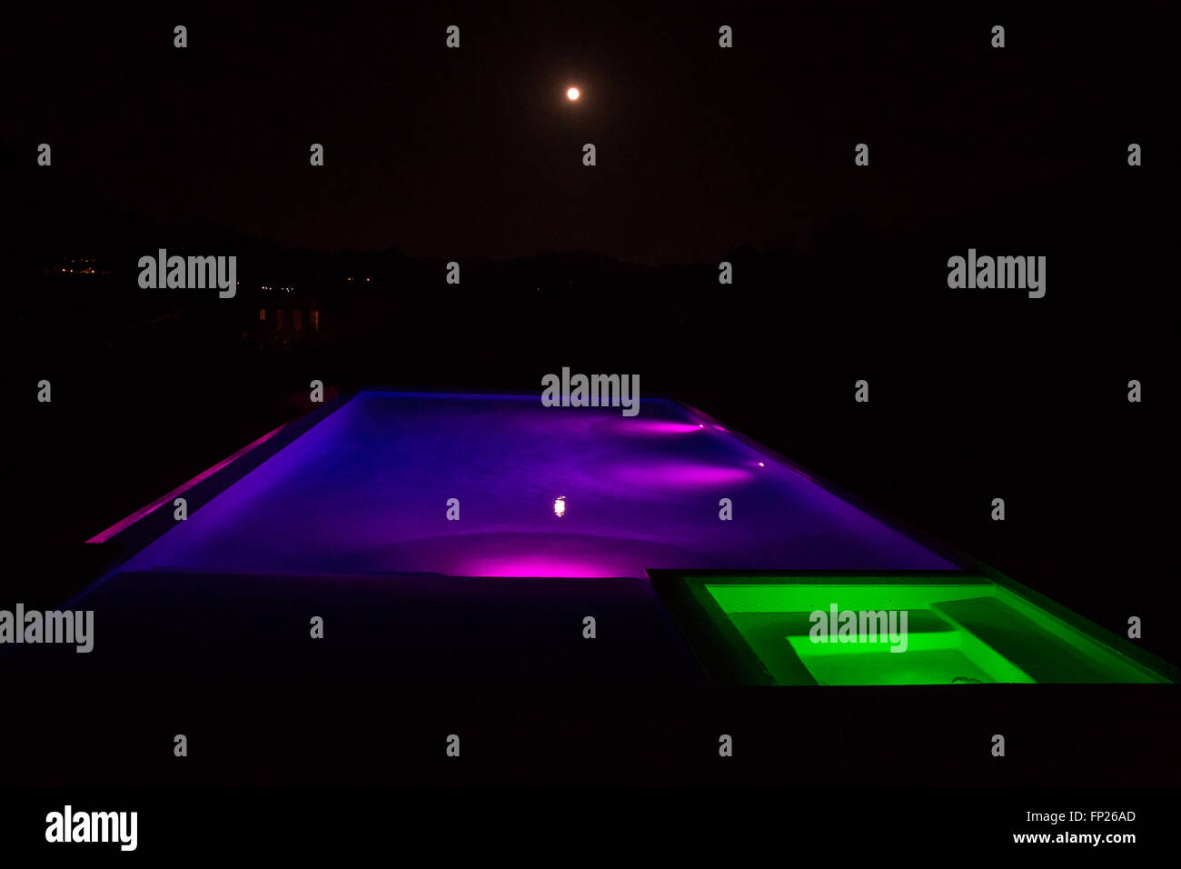 Blood Moon over a colorful swimming pool Stock Photo - Alamy