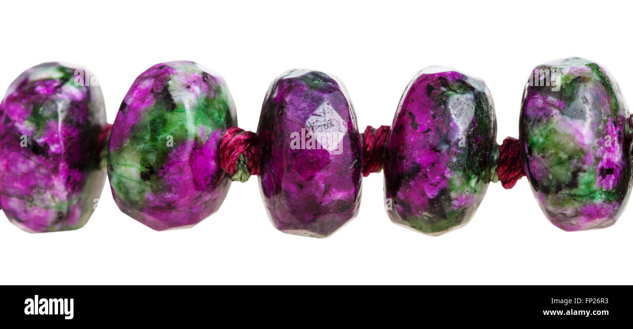 string of beads from Zoisite gem stone close up isolated on white ...