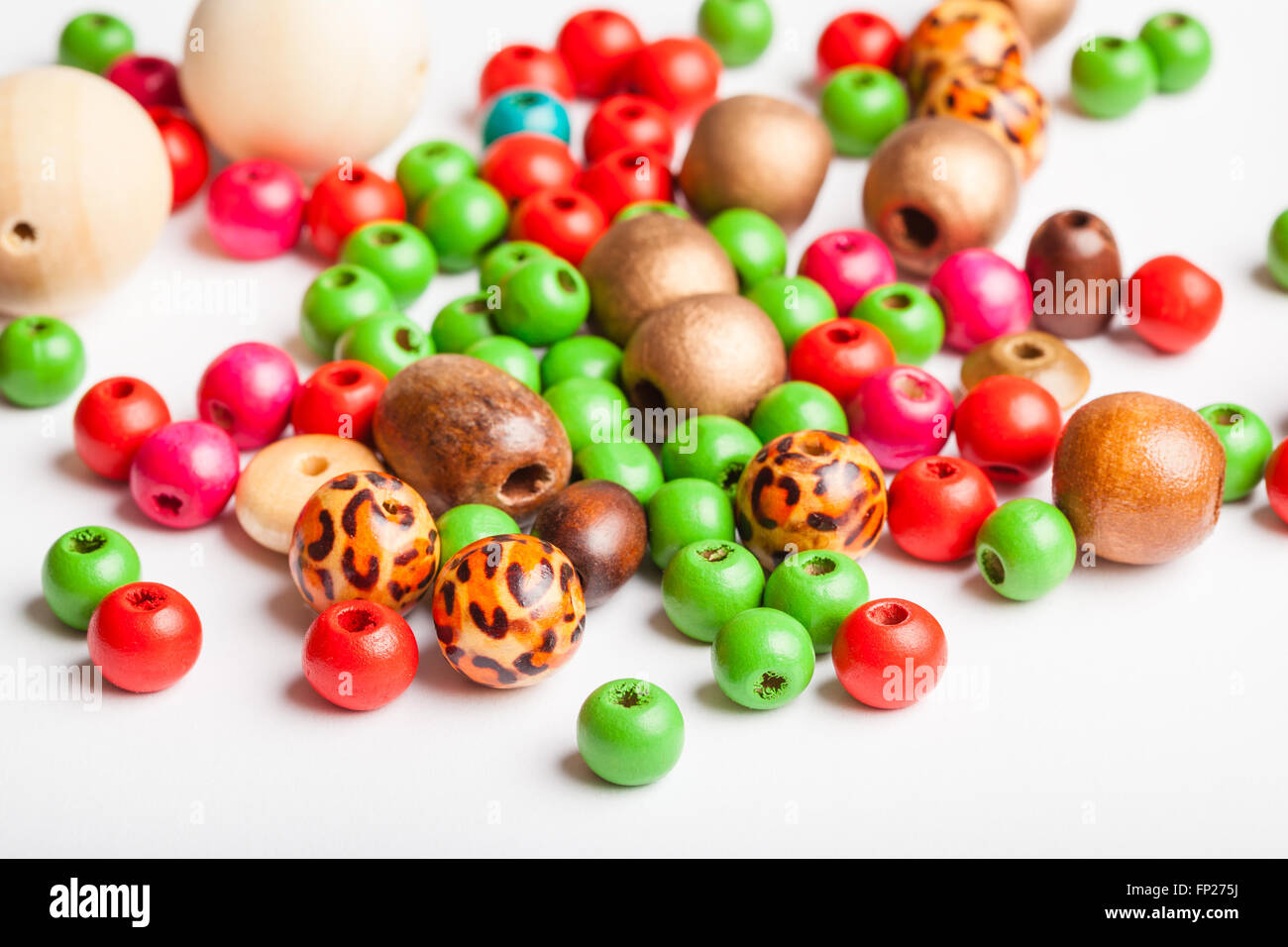 many various painted wooden beads close up Stock Photo - Alamy