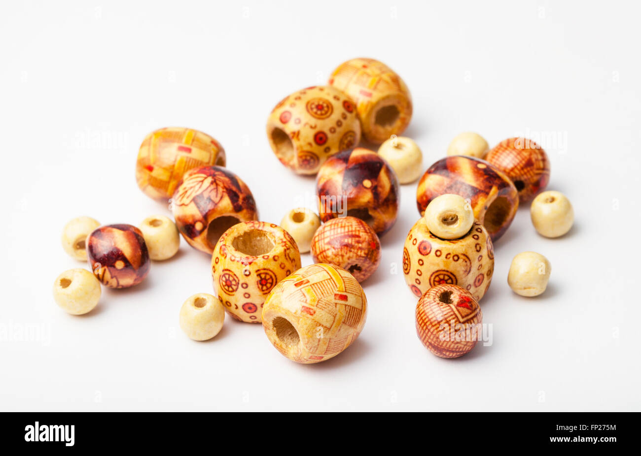 set of painted natural wood beads close up Stock Photo - Alamy