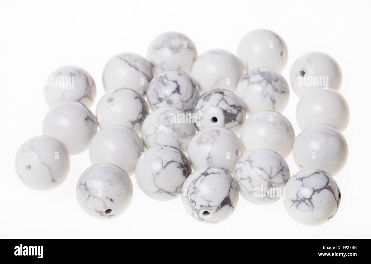 many beads from white howlite gemstone on white background Stock Photo ...
