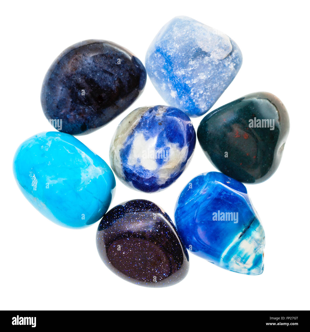 pile of blue natural mineral gemstones isolated on white background ...