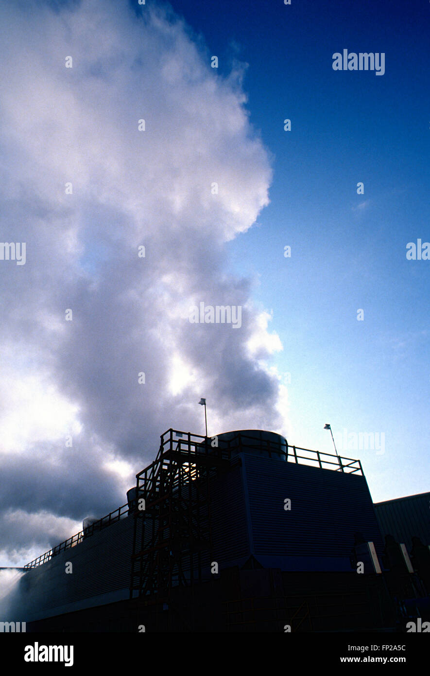 Steam rising from cooling tower; industrial plant Stock Photo - Alamy