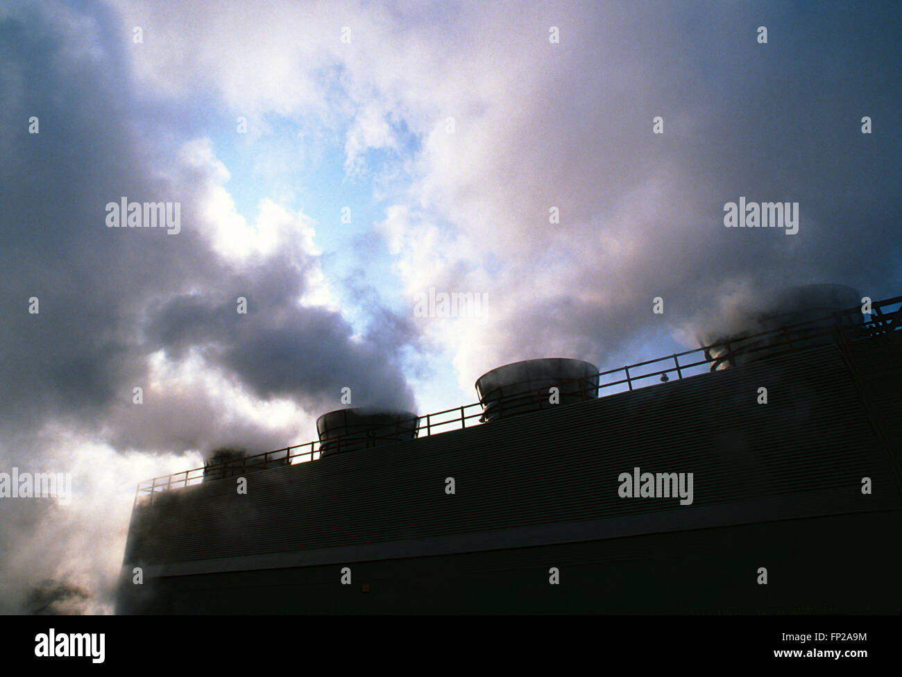Steam rising from cooling tower; industrial plant Stock Photo - Alamy