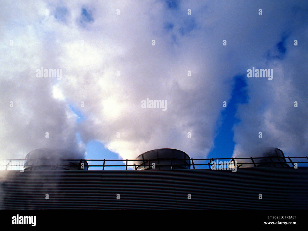 Steam rising from cooling tower; industrial plant Stock Photo - Alamy