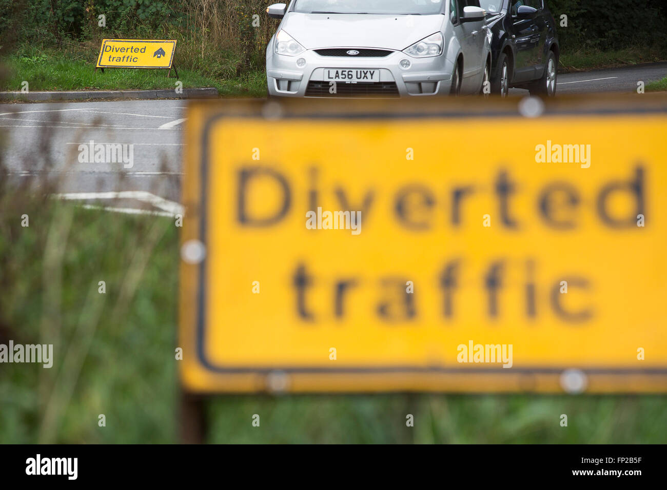Road signs on a country lane showing diverted traffic and closed roads ...