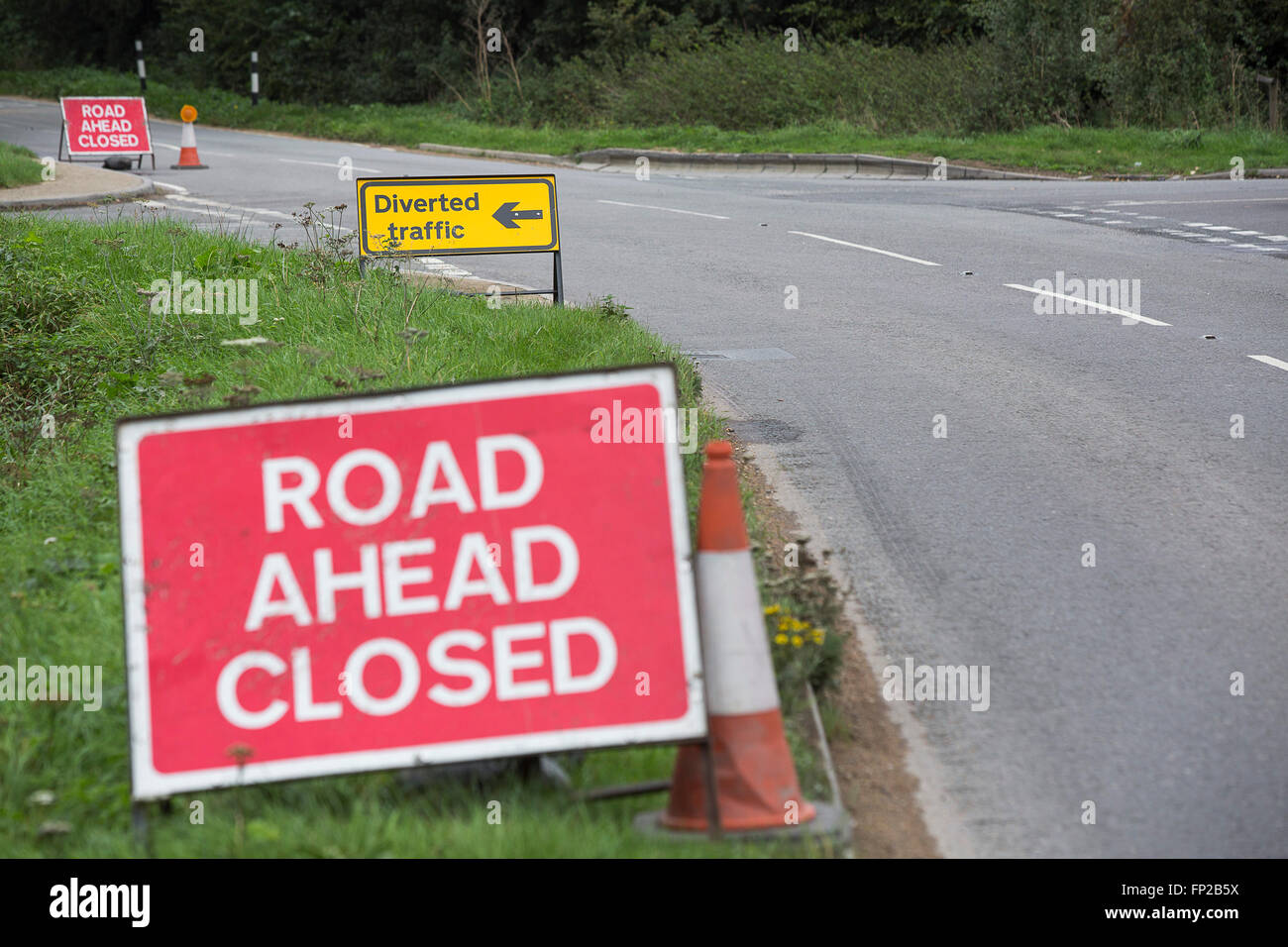 Road signs on a country lane showing diverted traffic and closed roads ...
