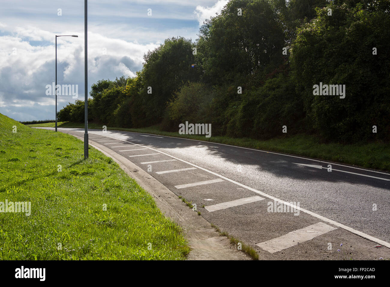 A quiet slip road allowing traffic off of a dual carrigeway Stock Photo ...