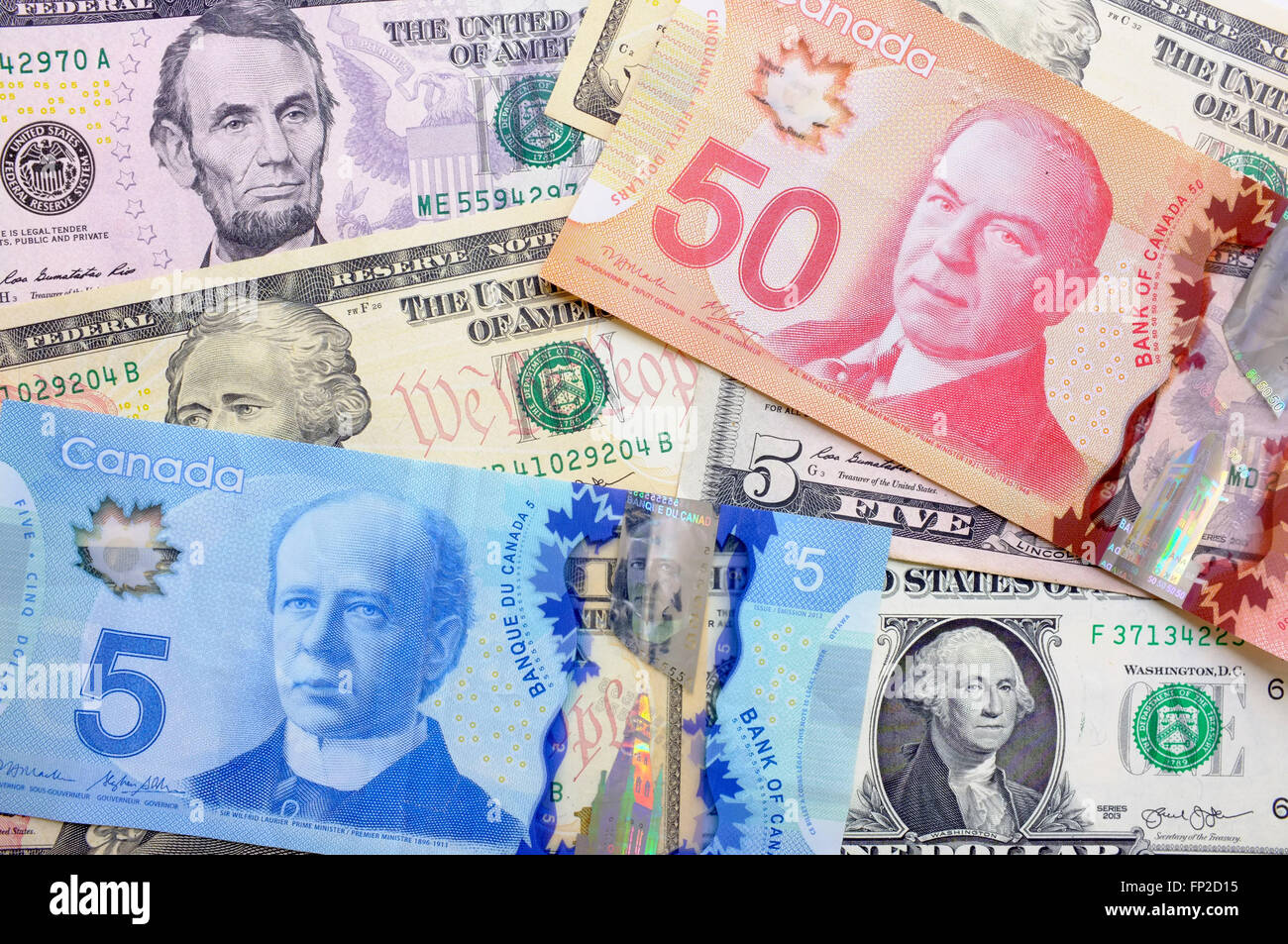 American And Canadian Dollars With South African Rand Notes Stock Photo american-and-canadian-dollars-with-south-african-rand-notes-stock-photo