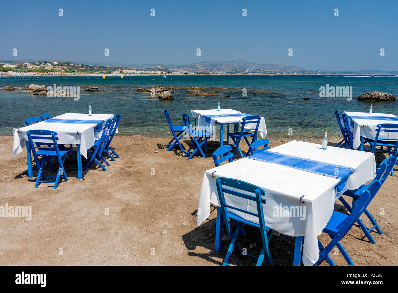 Tables with chairs in traditional Greek tavern in Kolympia town on ...