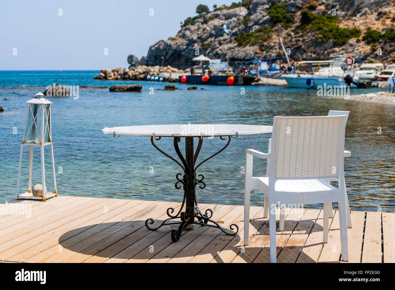 Tables with chairs in traditional Greek tavern in Kolympia town on ...
