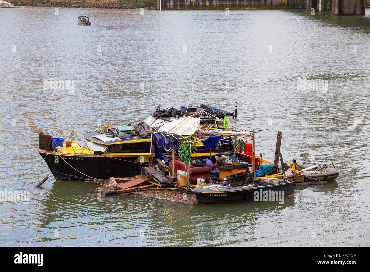 PORTLAND, OR - FEBRUARY 27, 2016: Homeless boat barge camp in the ...