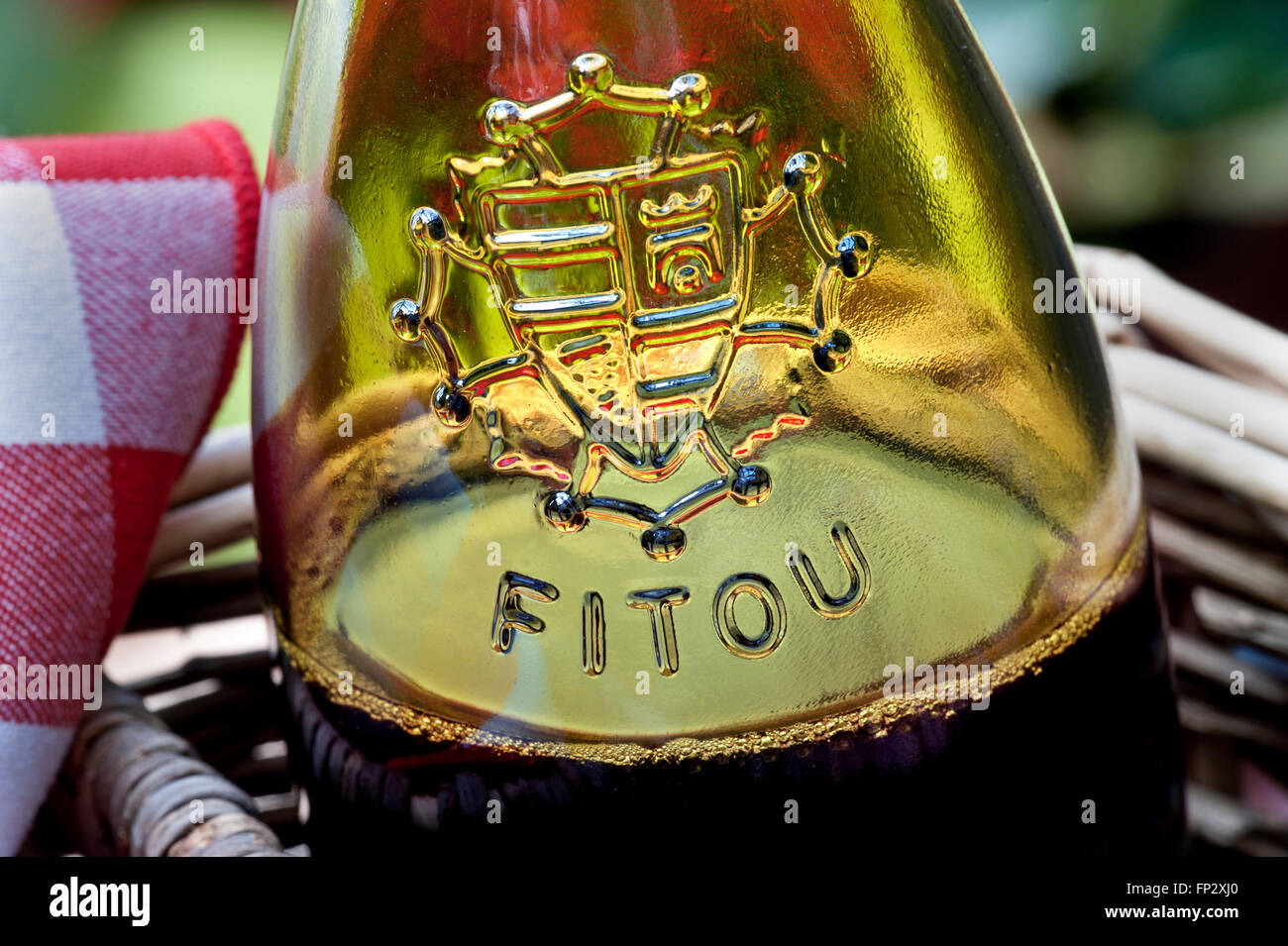 Fitou red wine bottle in rustic wicker basket Languedoc France Stock ...
