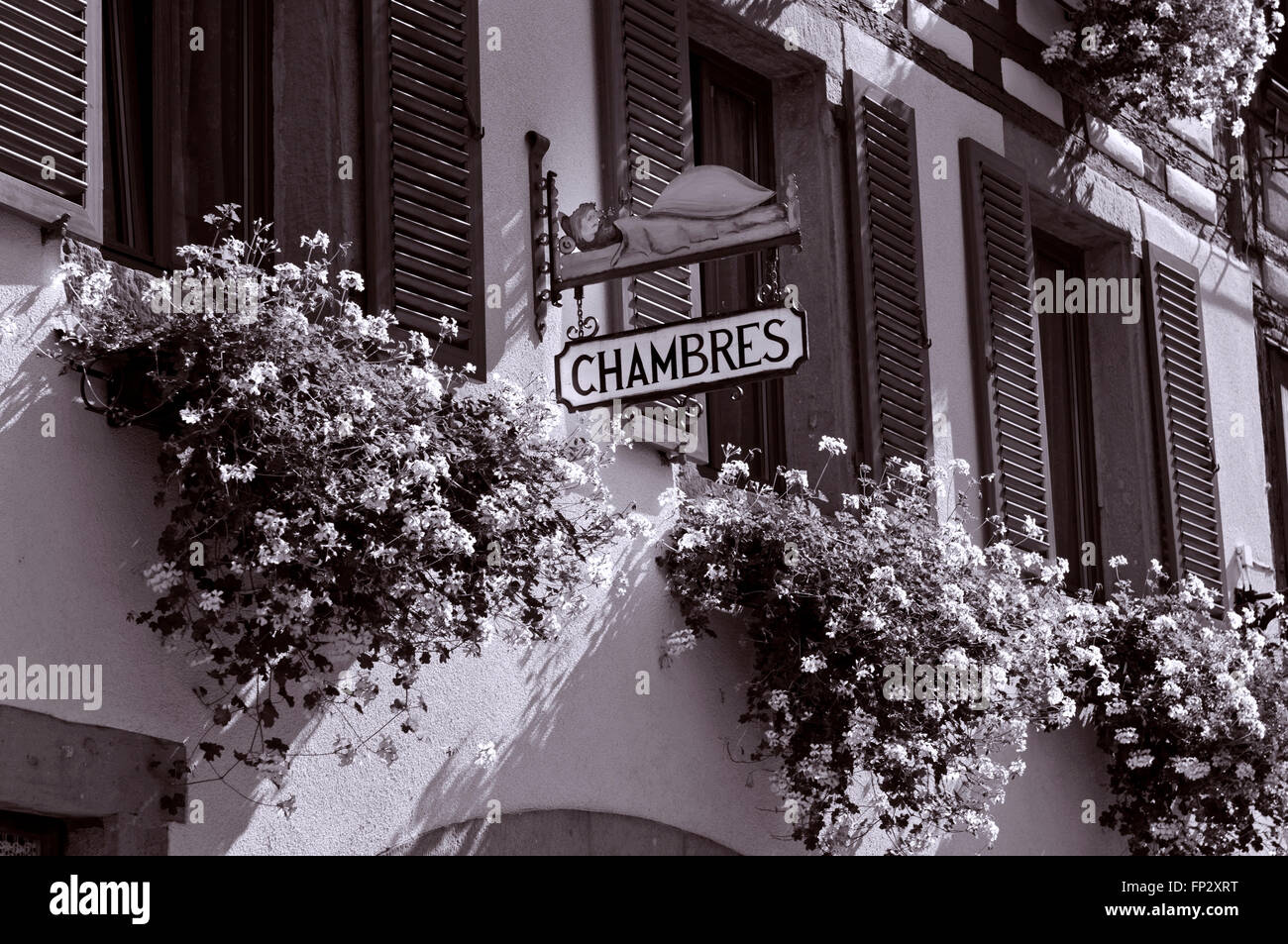Typical toned retro B&W of French B+B Gite 'Chambres' sign with typical ...