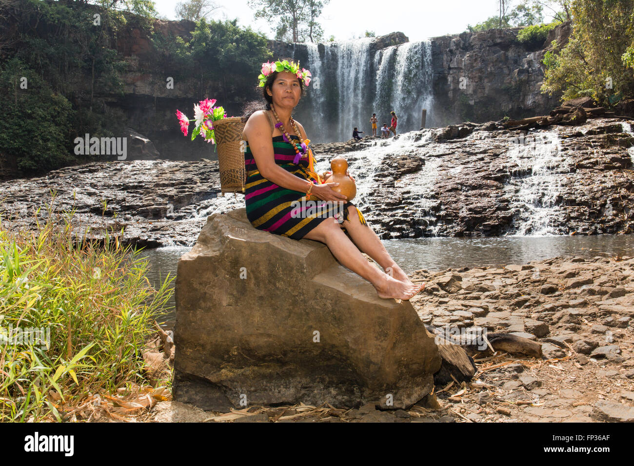 Phnong woman posing for tourists at the Bousra waterfall, Bunong, Bou ...